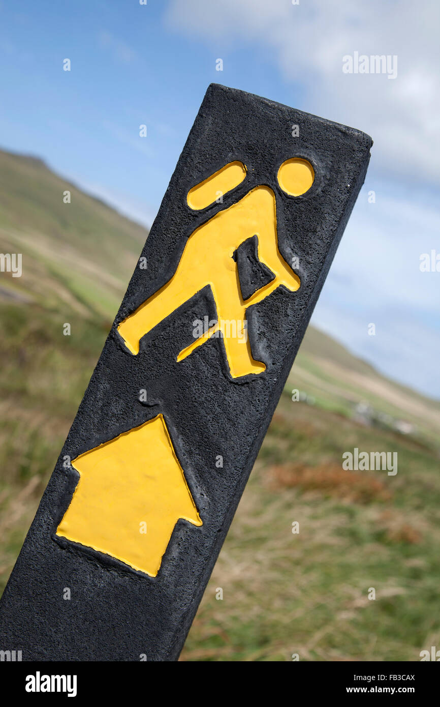 Yellow Hiking Sign with Rural Background Stock Photo - Alamy