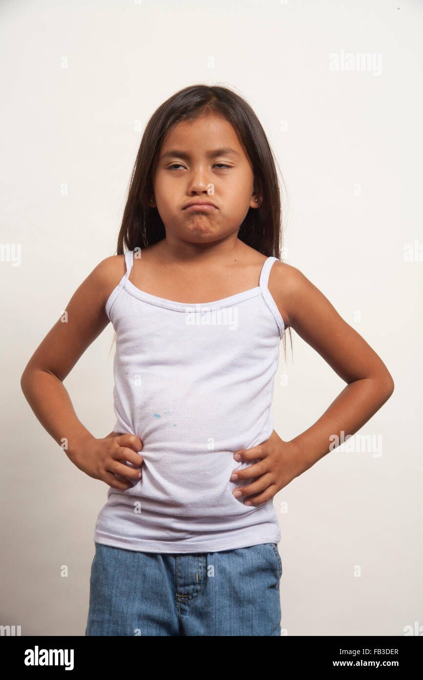 With hands on her hips, a demonstrative Native American girl member of ...