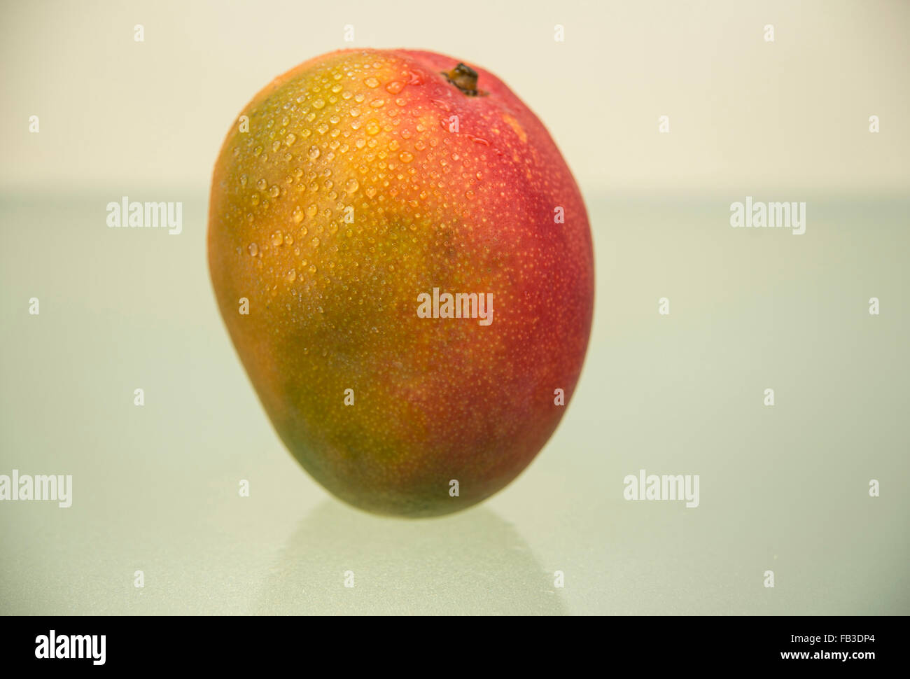 A whole mango Stock Photo - Alamy