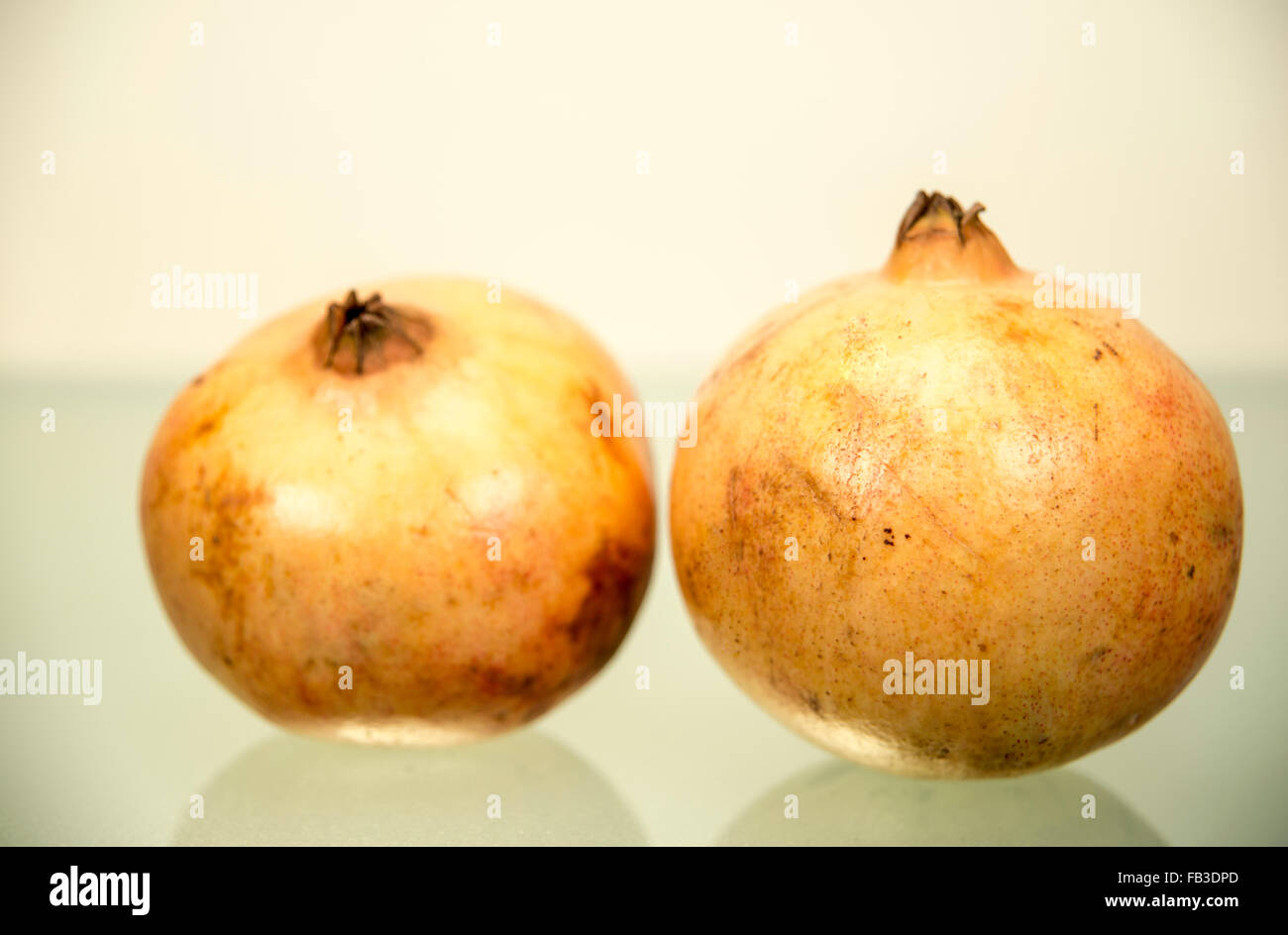 Two whole pomegranates hi-res stock photography and images - Alamy