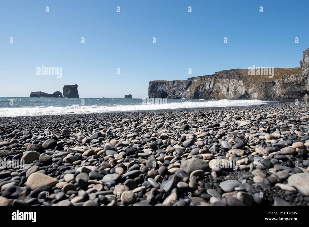 The famous black sand beach coastline and rock formations in Vik ...