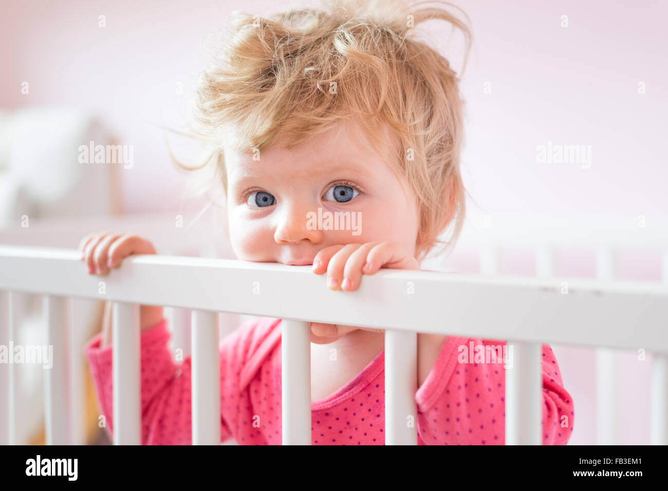 One year old baby in her cot Stock Photo - Alamy