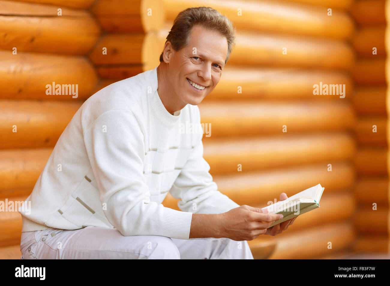 Nice man reading book Stock Photo - Alamy