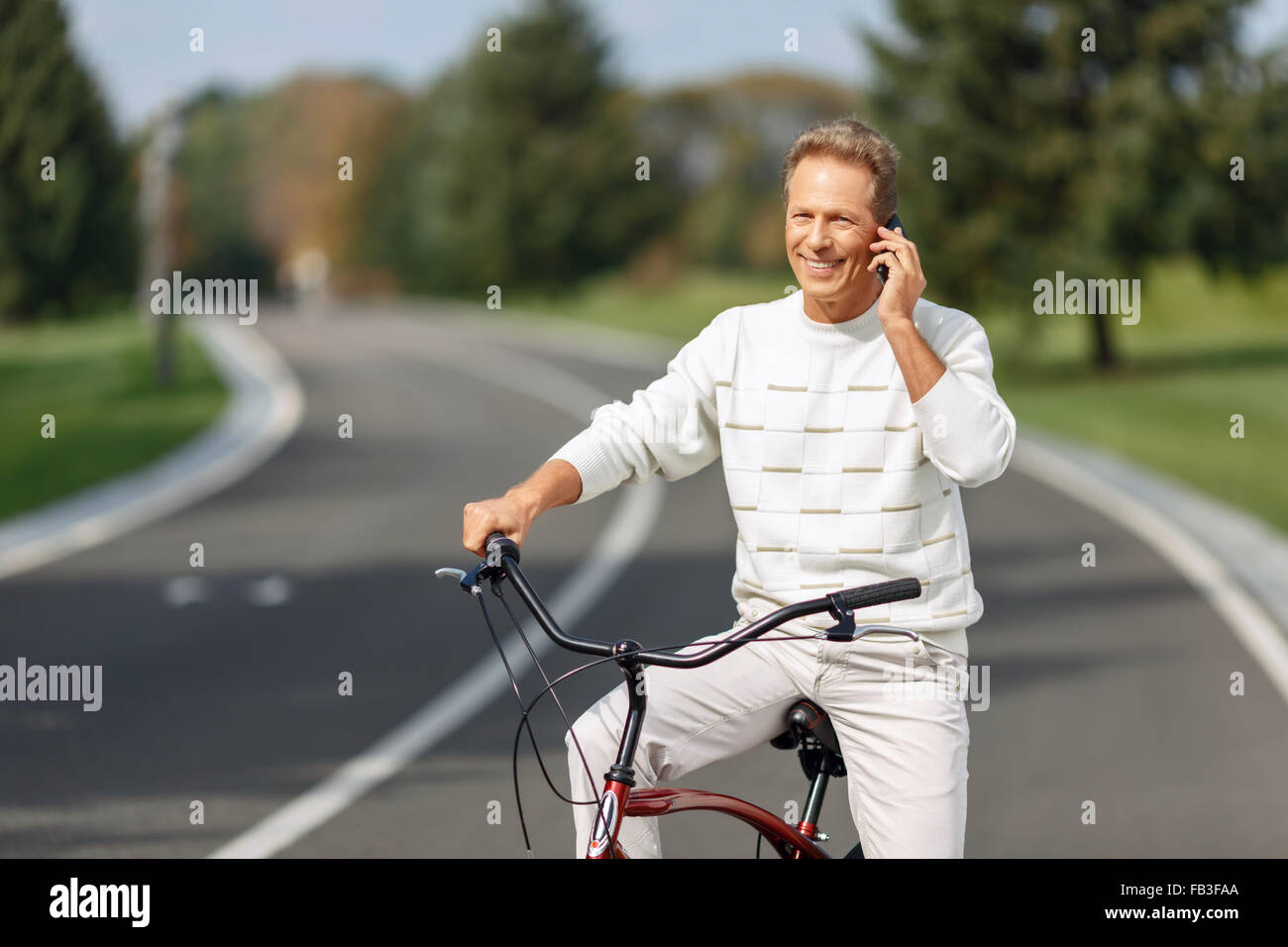 Adult man riding a bicycle hi-res stock photography and images - Alamy