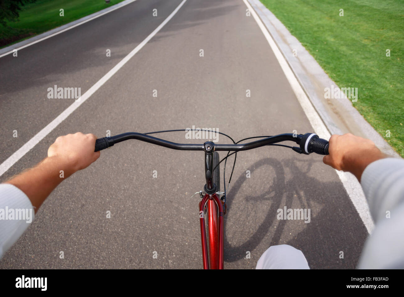 Adult man riding a bicycle Stock Photo - Alamy