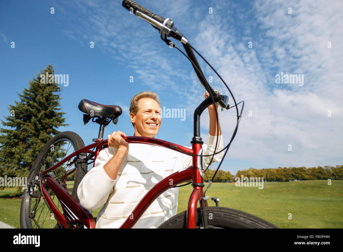 Adult man riding a bicycle hi-res stock photography and images - Alamy