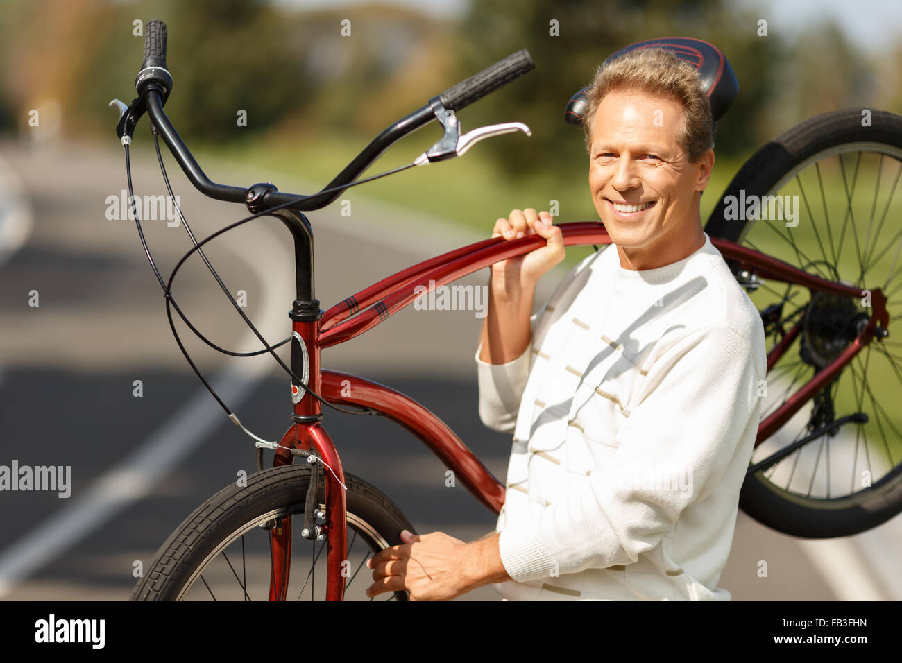 Adult man riding a bicycle Stock Photo - Alamy