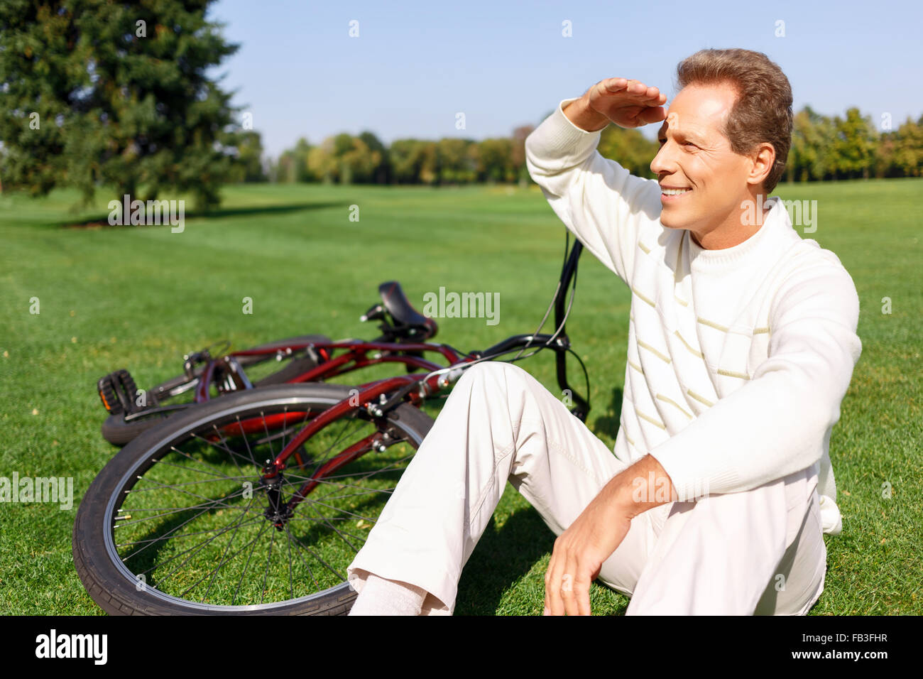 Adult man riding a bicycle hi-res stock photography and images - Alamy
