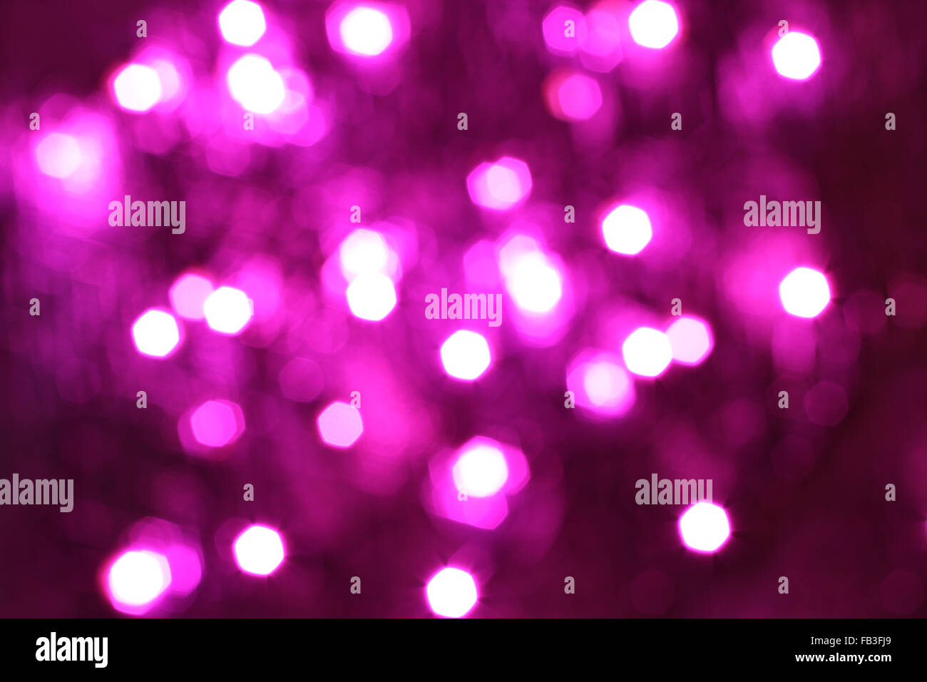 Blurred white and magenta lights on black background Stock Photo - Alamy