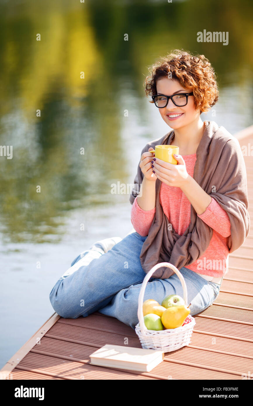 Charming girl drinking tea Stock Photo - Alamy