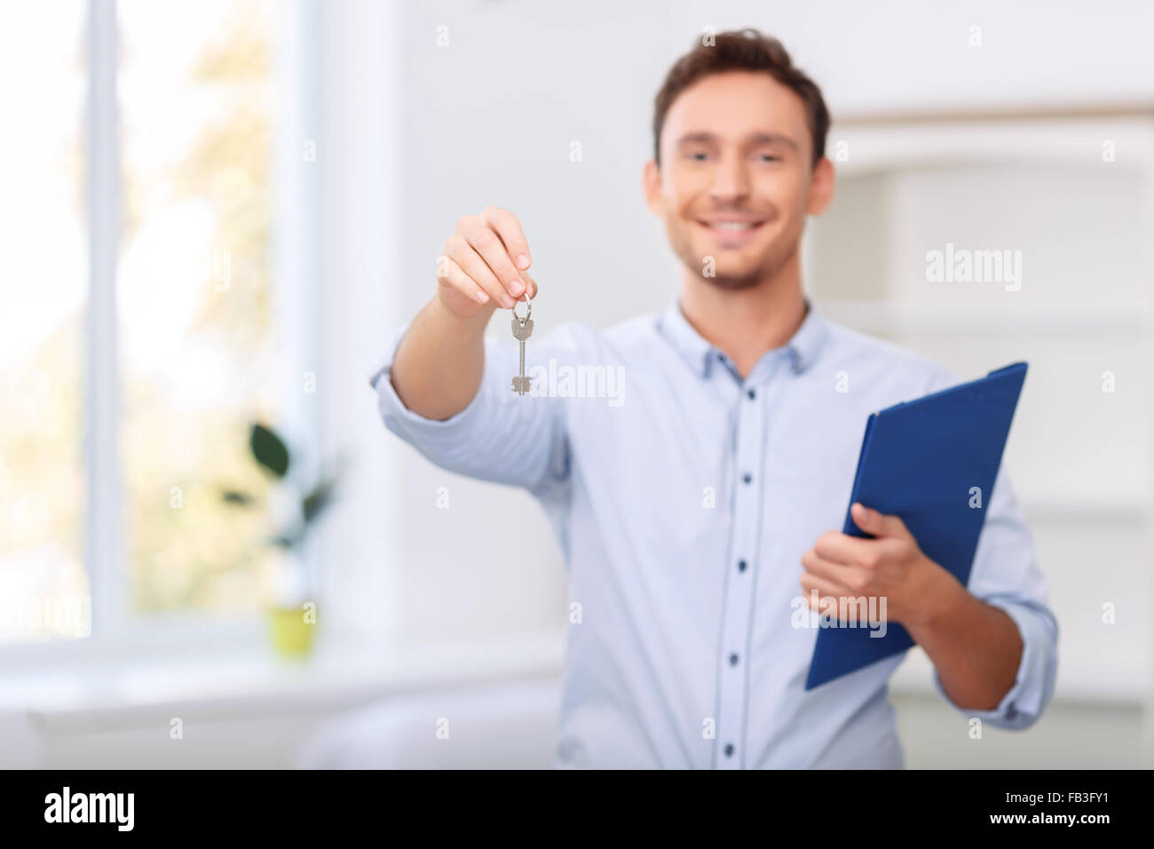 Professional realtor holding folder Stock Photo - Alamy