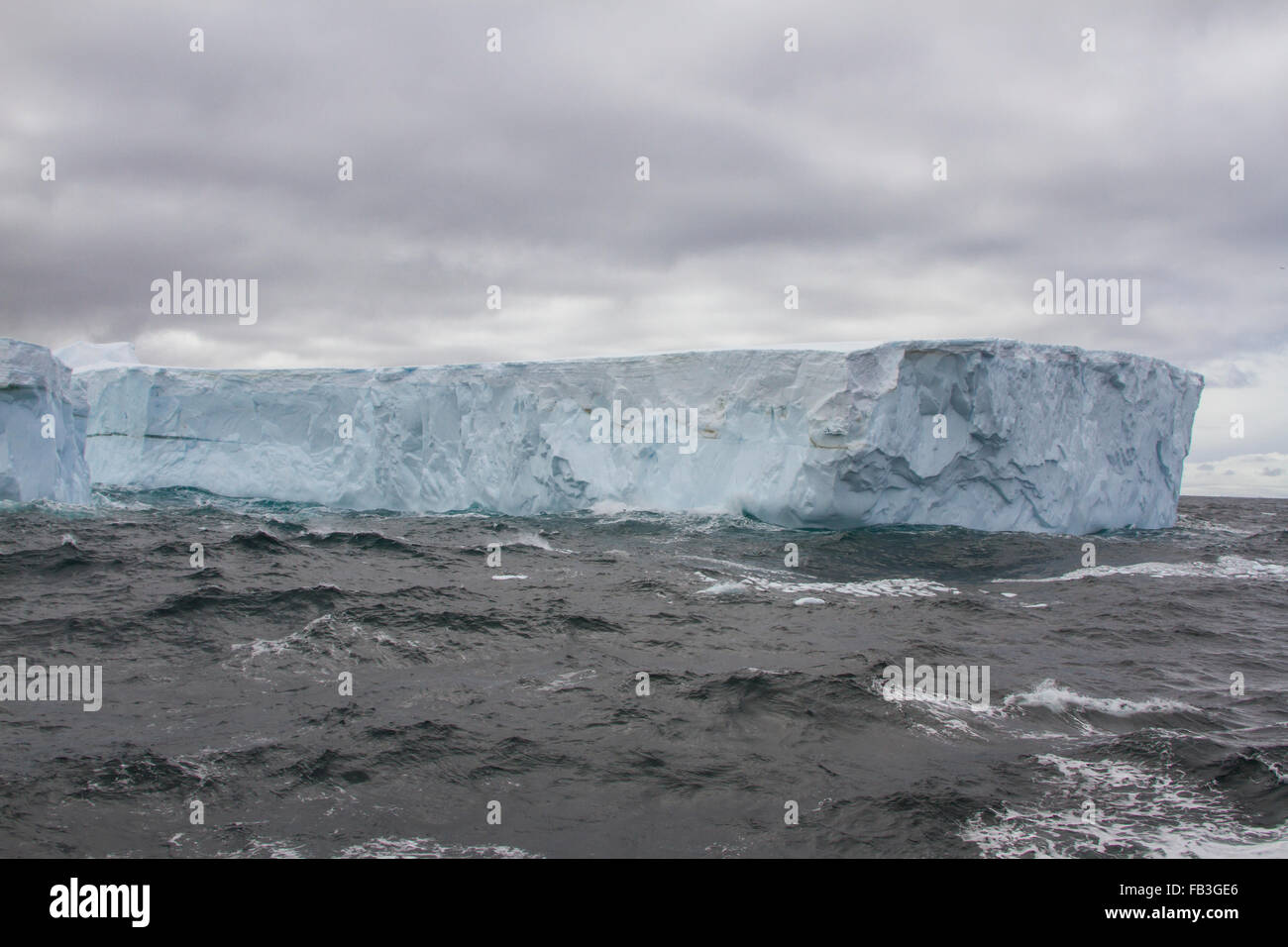 Large floating shelf iceberg floating in Antarctica Stock Photo - Alamy