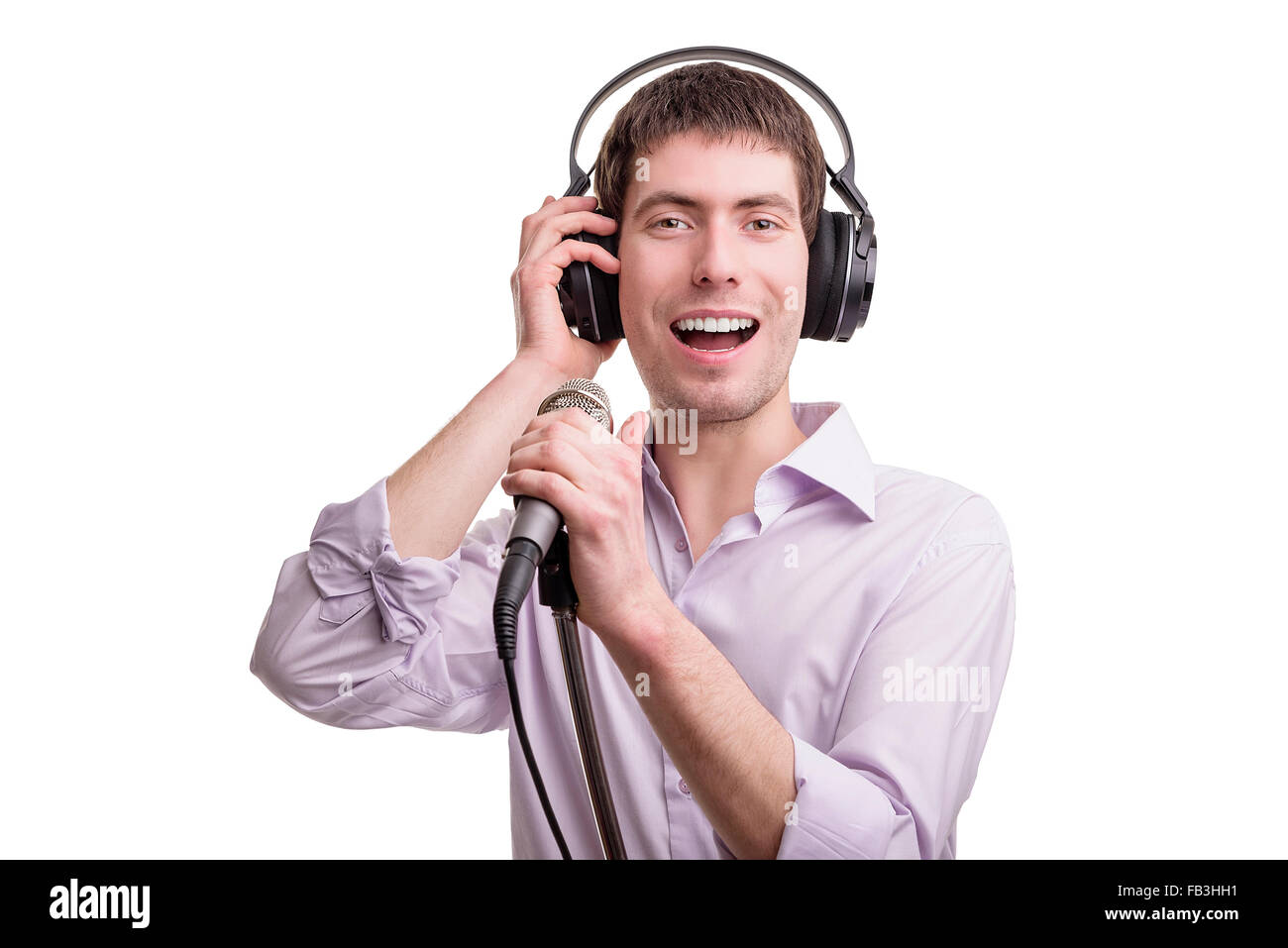 Man singing into microphone Stock Photo - Alamy