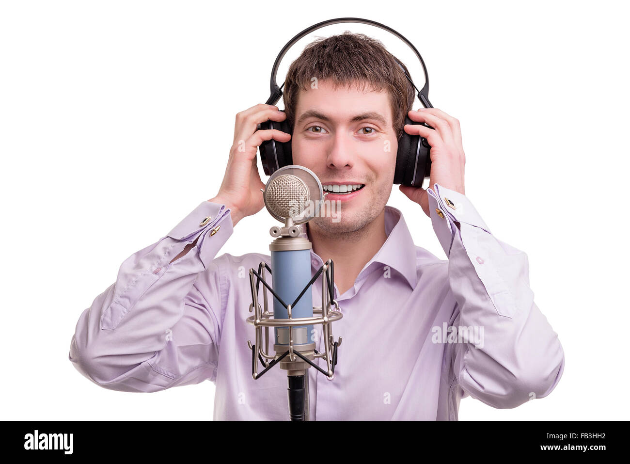 Man singing into microphone Stock Photo - Alamy