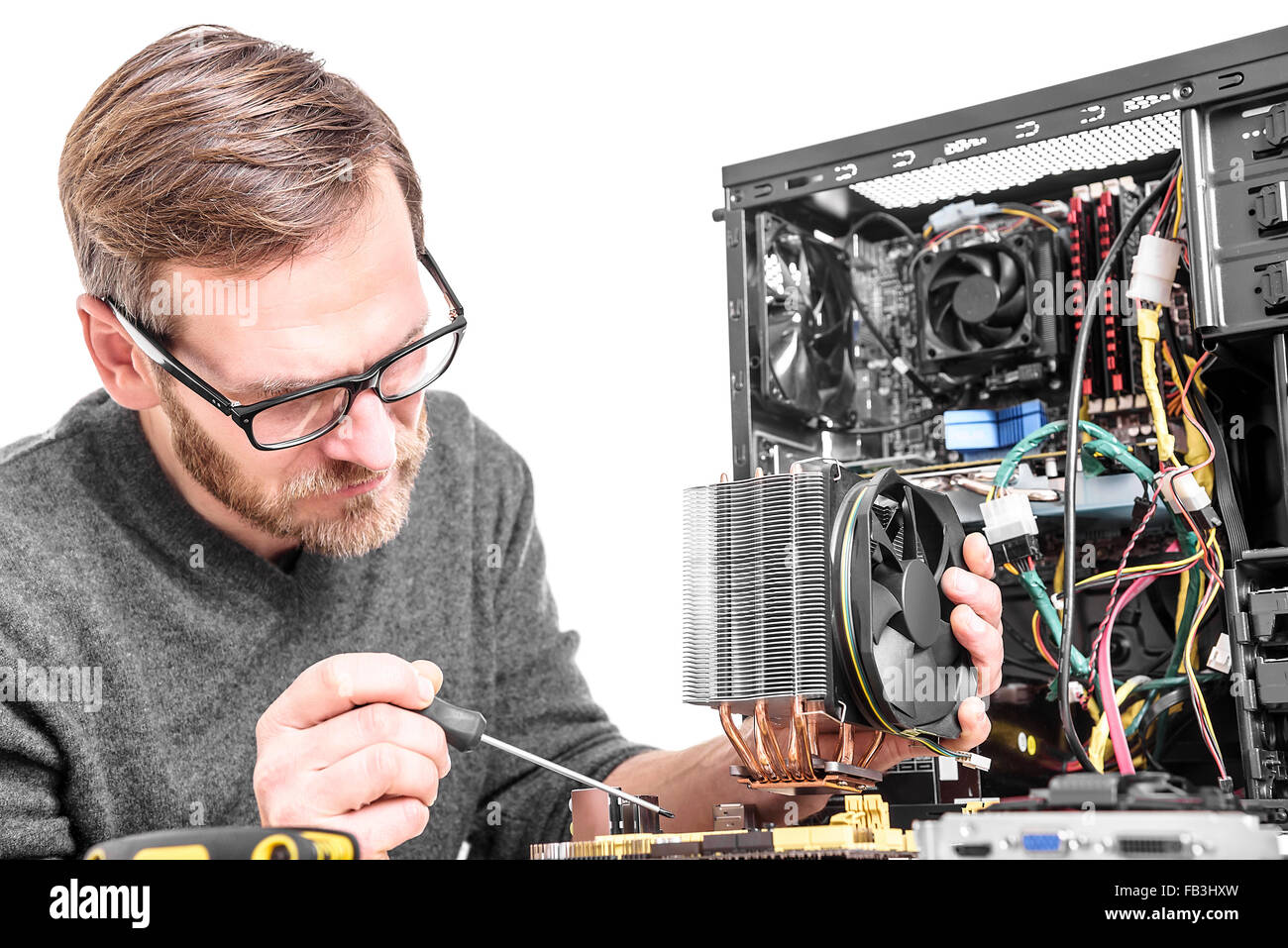 Computer technician installs cooling system Stock Photo - Alamy