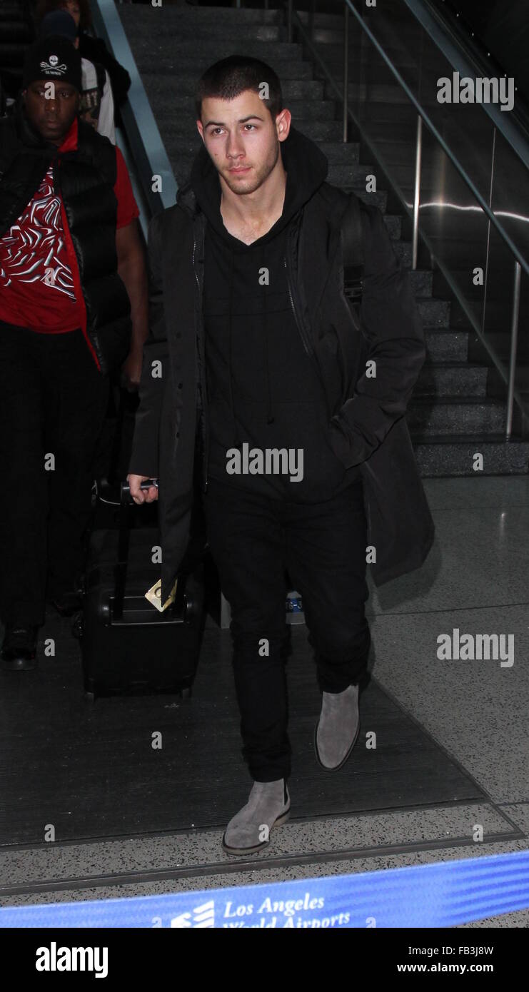 Nick Jonas arrives on a flight to Los Angeles International Airport ...