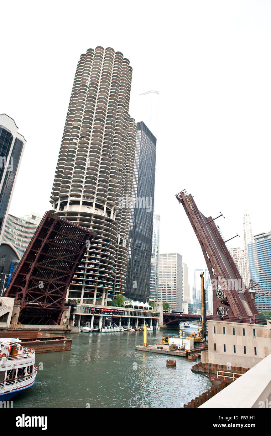 Raised, closed bridge on Chicago river in front of the Marina Towers in ...