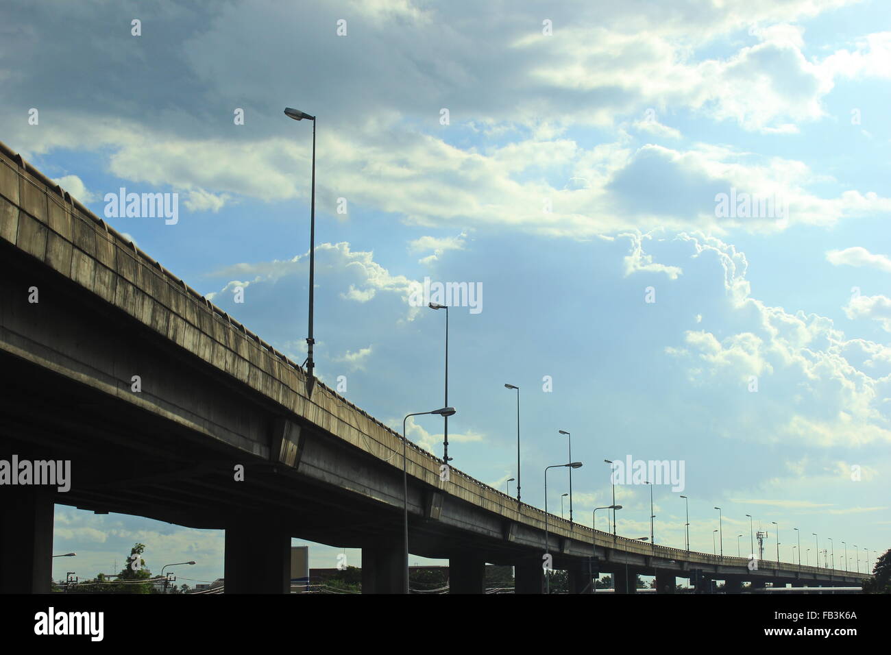 background of elevated bridge with street light during the evening ...