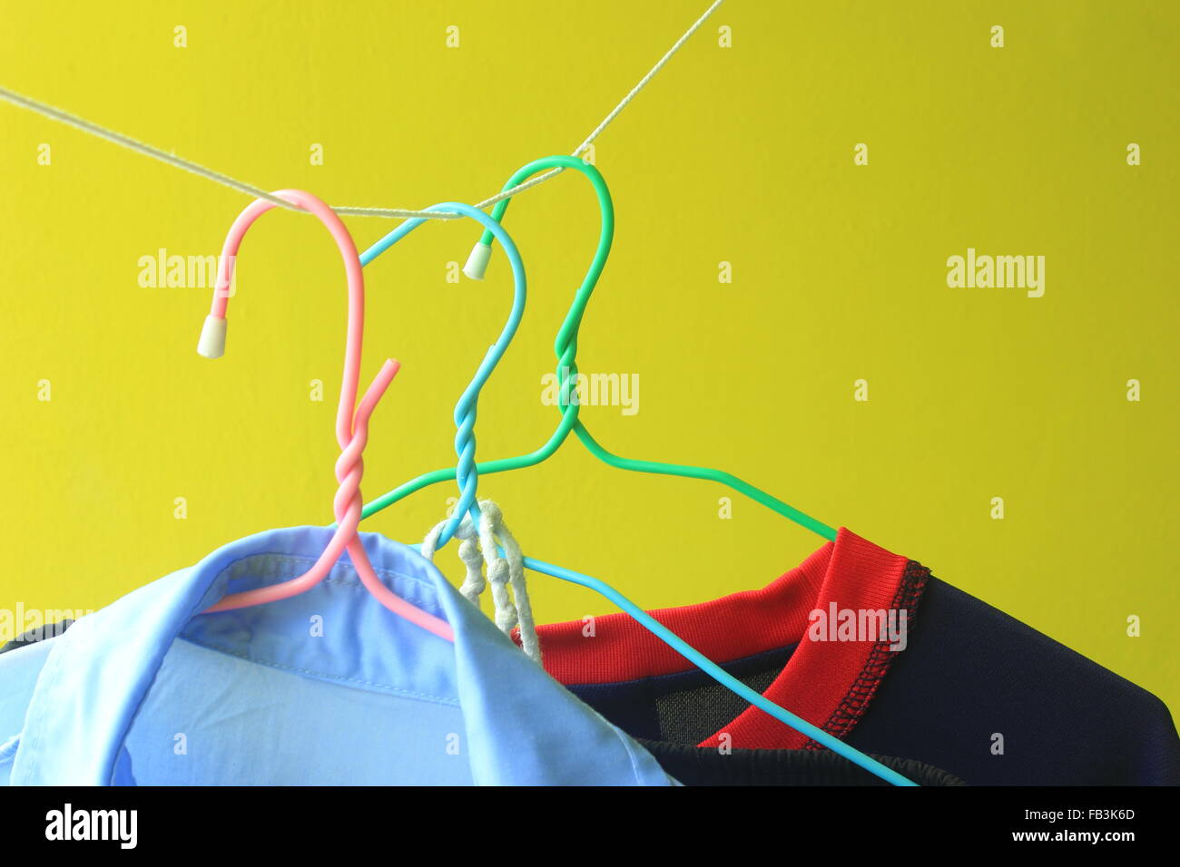 background of hanger and clothes line made by thread Stock Photo - Alamy