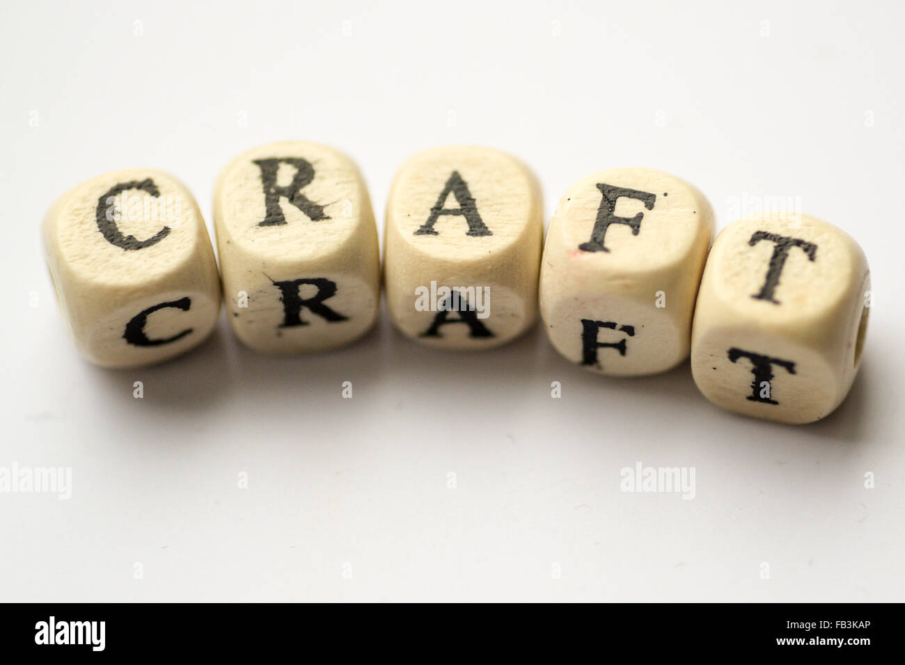 The craft word created with wooden alphabet letters on a white ...