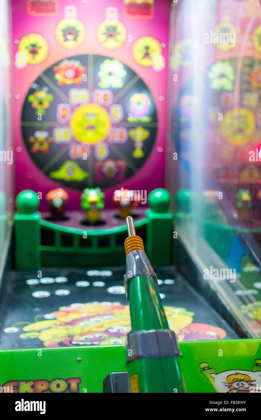 Empty arcade machine with a stationary gun waiting for players to use ...