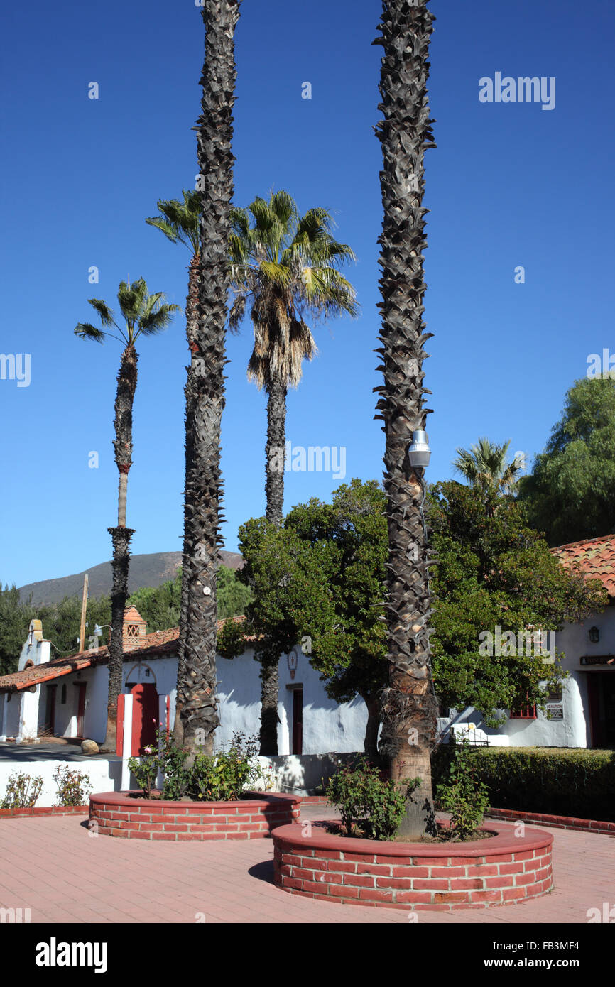 Giant palm trees in front of San Antonio de Pala mission in California ...
