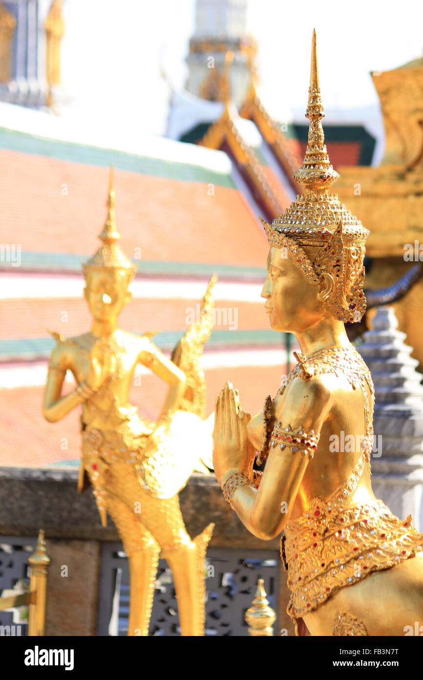 Golden Angel Statue at The Emerald Buddha Temple in Bangkok Stock Photo ...