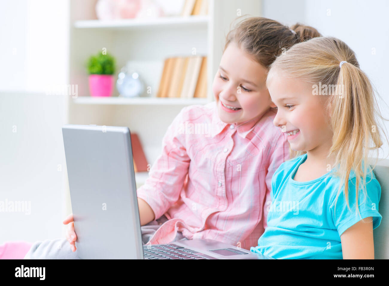 Happy sisters having fun together Stock Photo - Alamy
