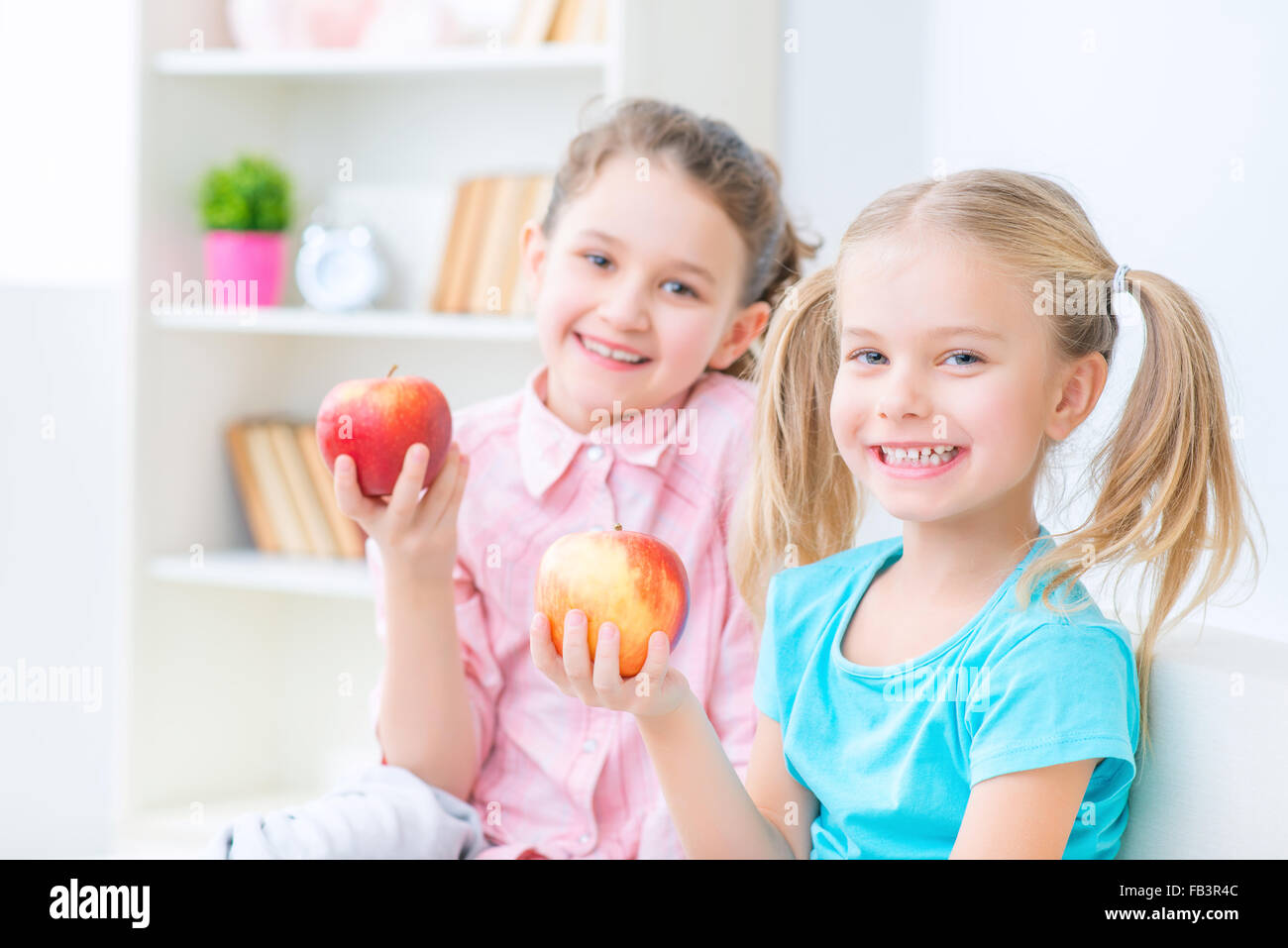 Happy sisters having fun together Stock Photo - Alamy