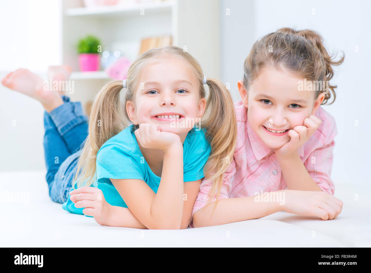 Pretty sisters having fun at home Stock Photo - Alamy