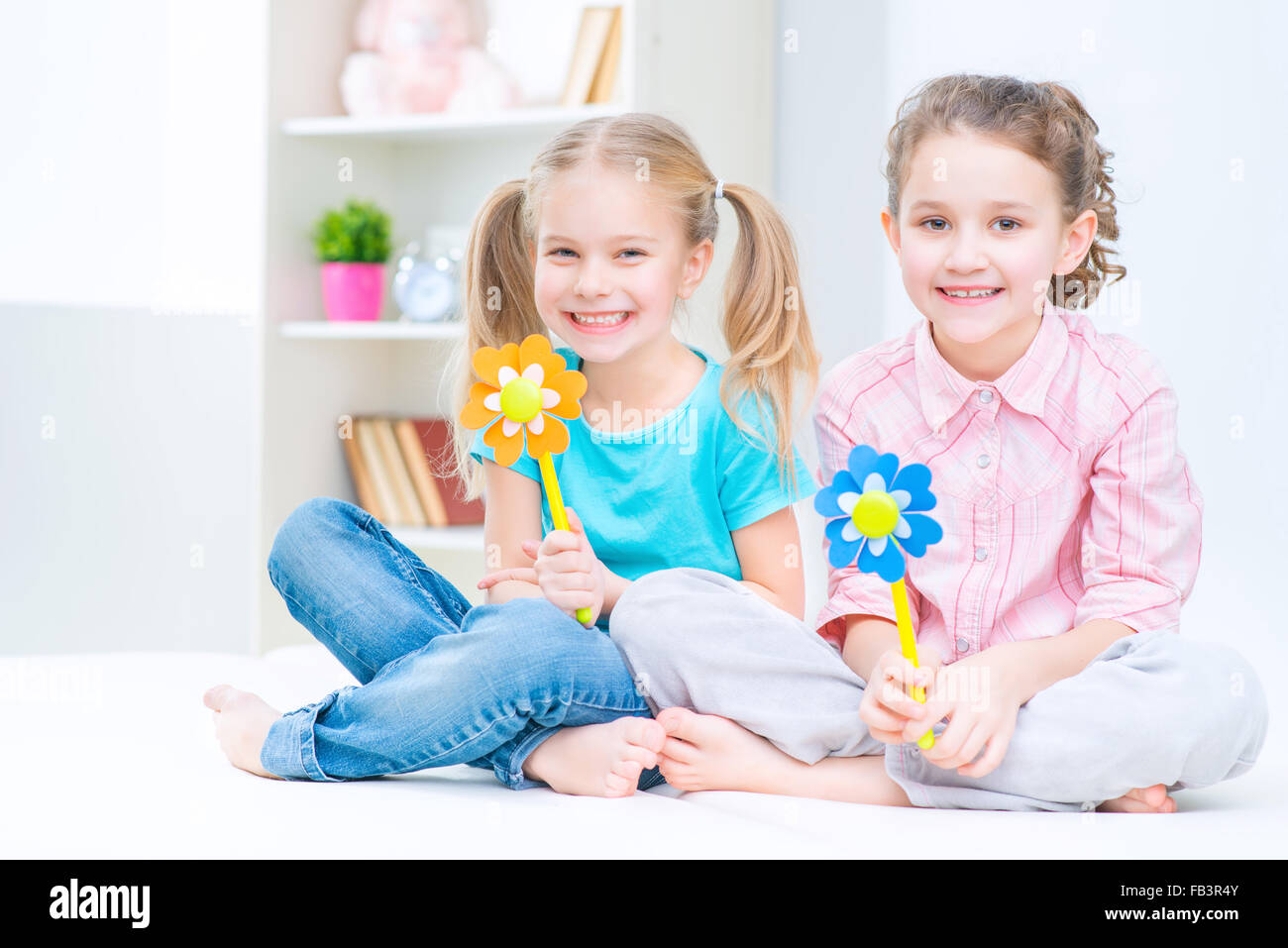 Pretty sisters having fun at home Stock Photo - Alamy
