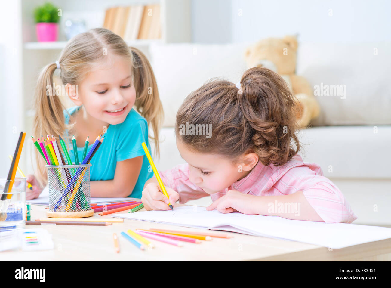 Pretty sisters having fun at home Stock Photo - Alamy