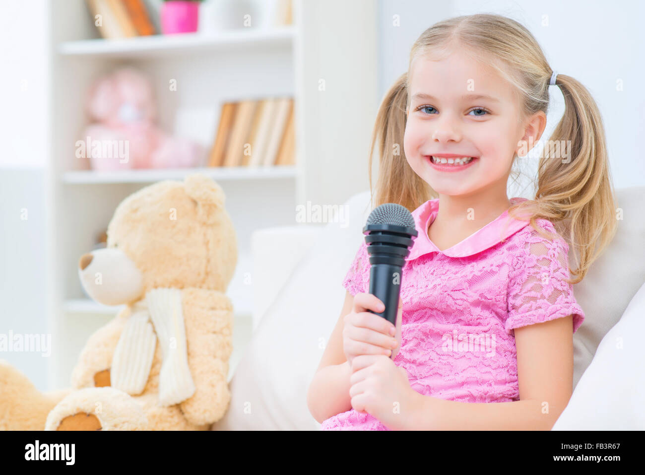 Girl singing microphone excited hi-res stock photography and images - Alamy