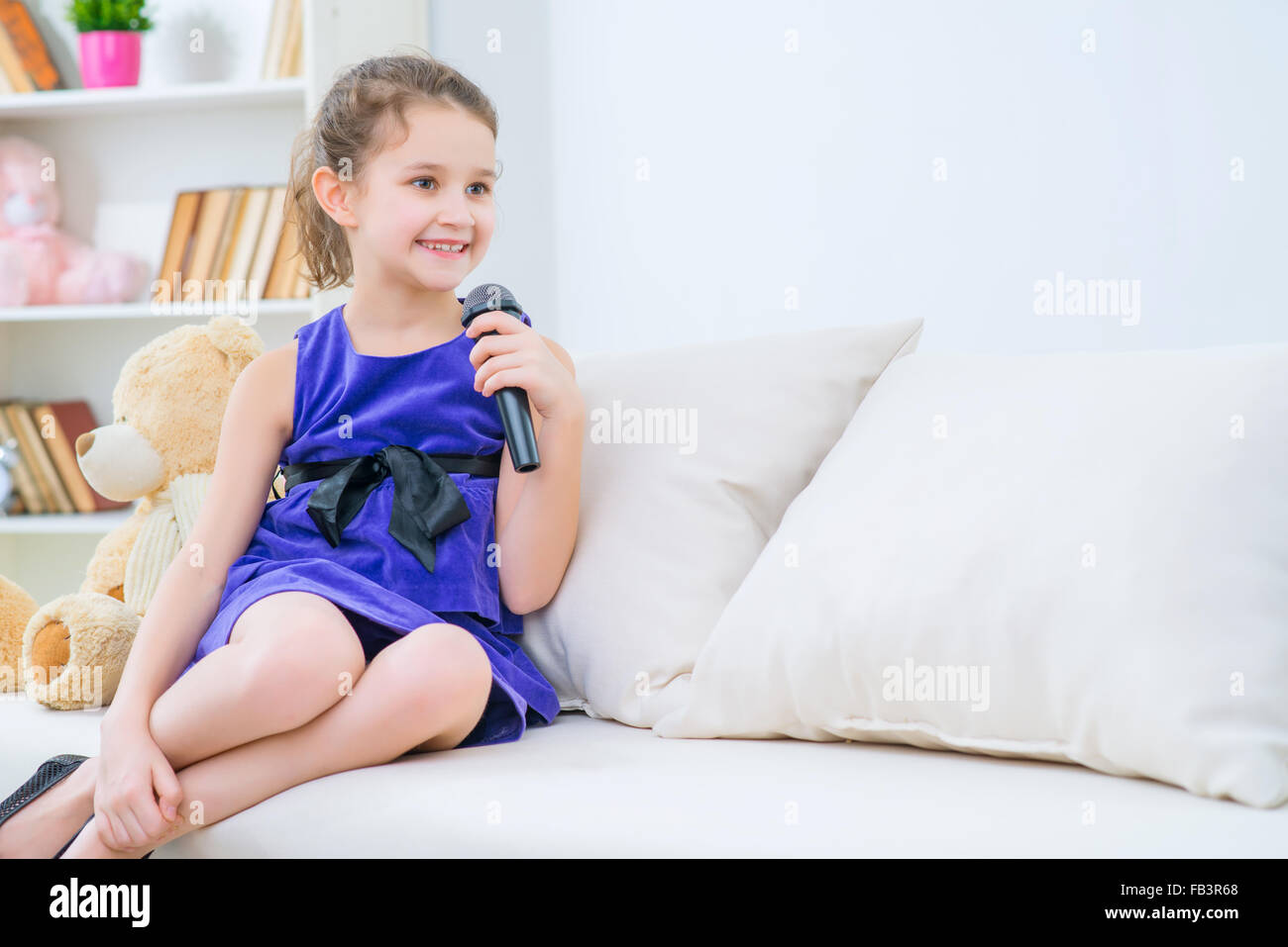 Pleasant girl singing Stock Photo - Alamy