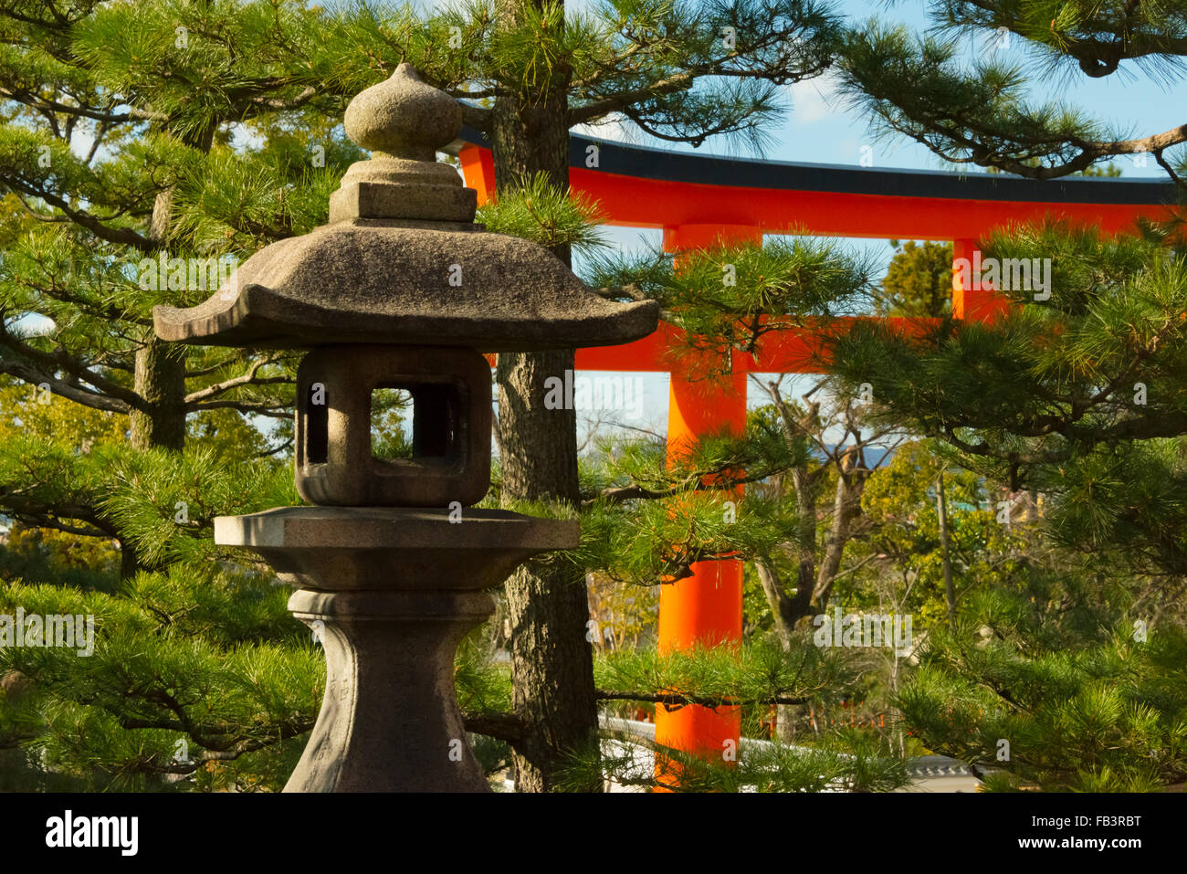Stone lantern and Torii gate in Fushimi Inari Shrine, Kyoto, Japan ...