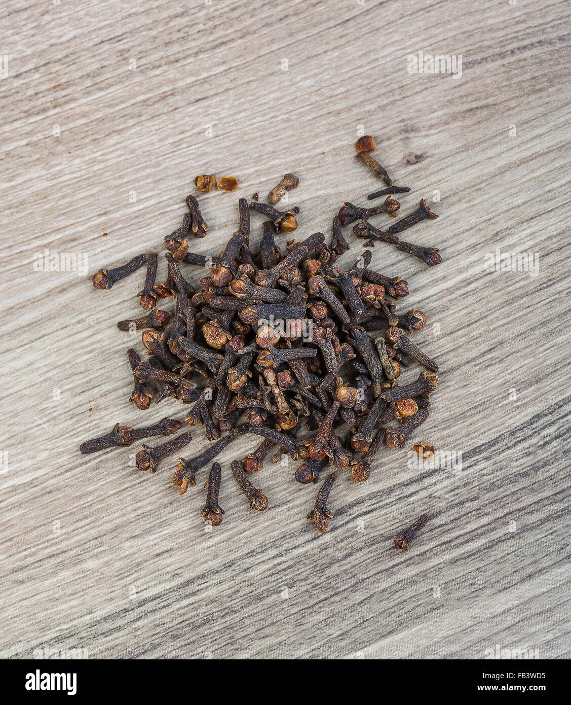 Aromatic Dried Cloves seeds on the wood background Stock Photo - Alamy