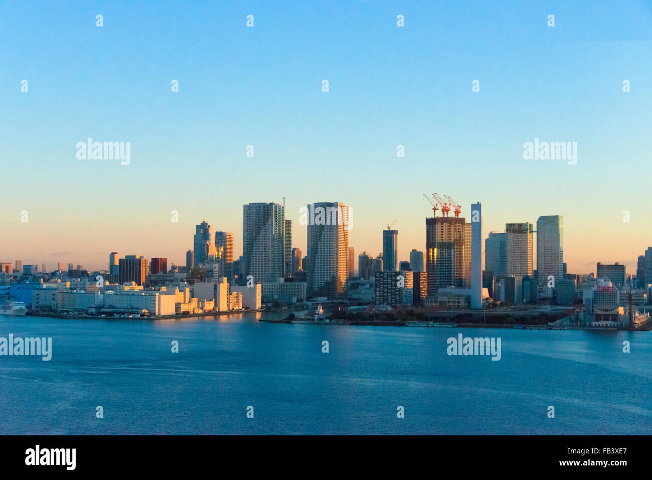 High rises along the waterfront in Tokyo Harbor at dawn, Tokyo, Japan ...