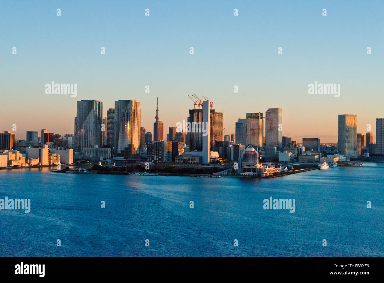 High rises along the waterfront in Tokyo Harbor at dawn, Tokyo, Japan ...