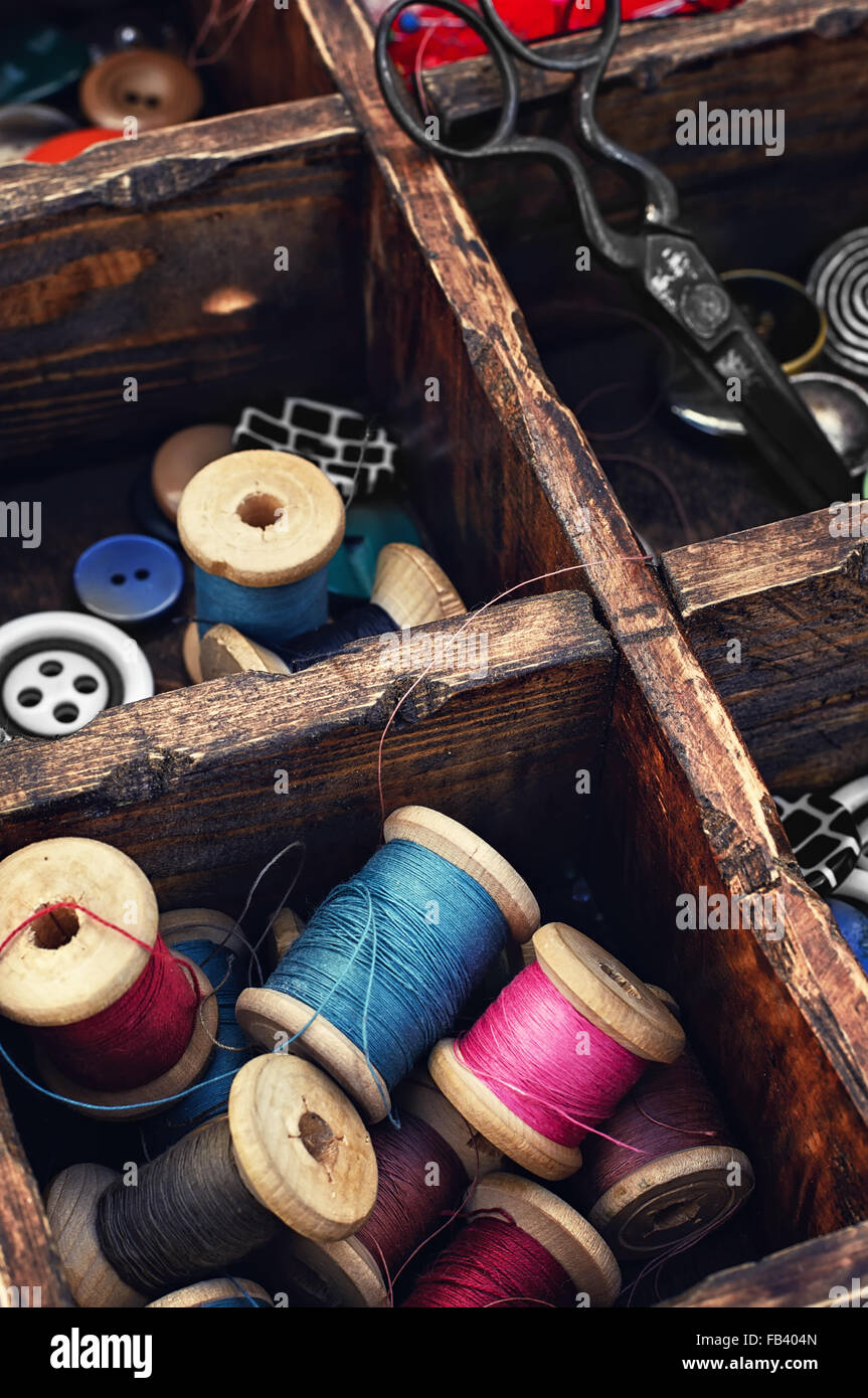 Sewing kit with threads and buttons in the cells wooden box Stock Photo ...