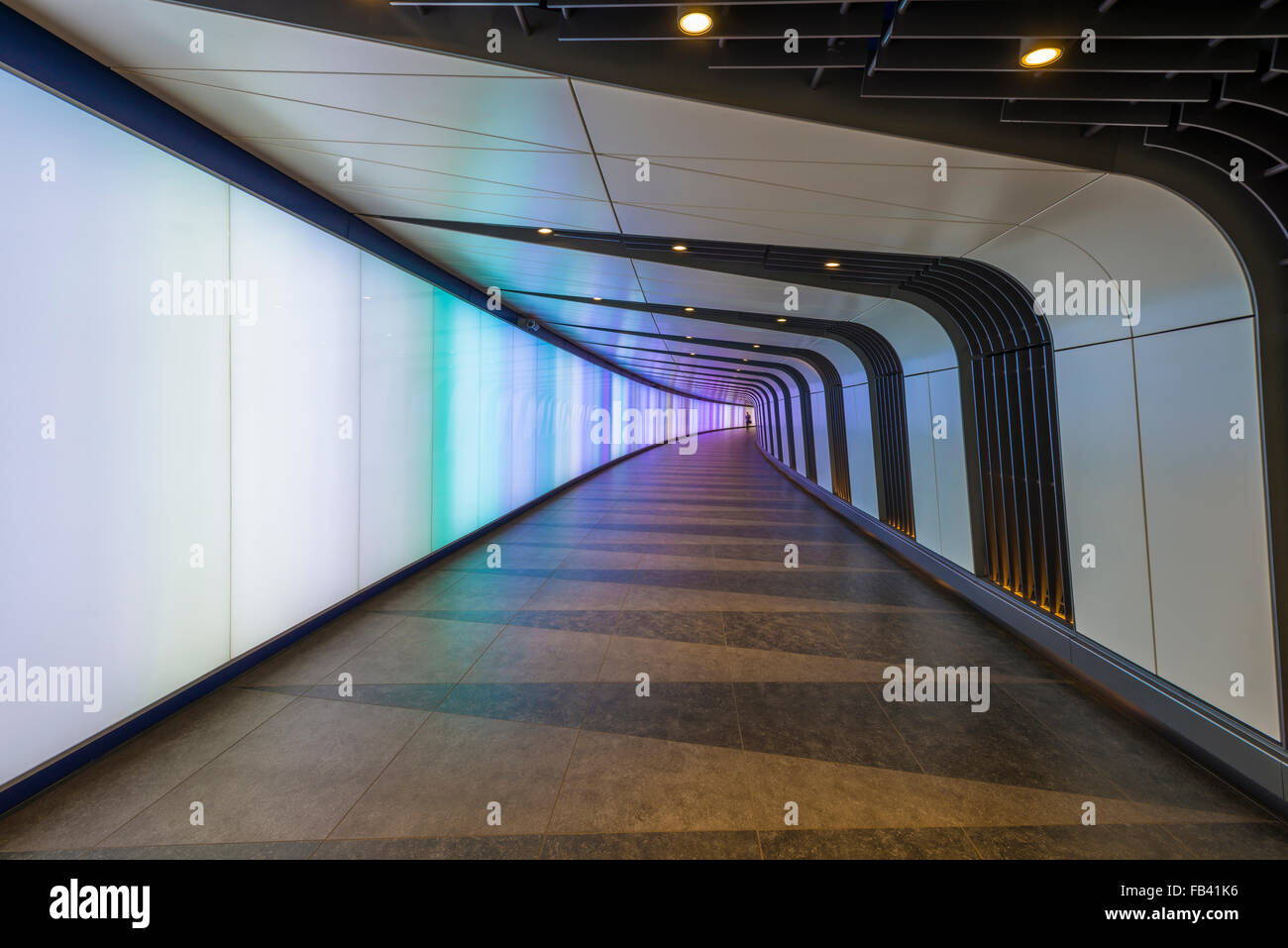 Pedestrian tunnel features led integrated hi-res stock photography and ...