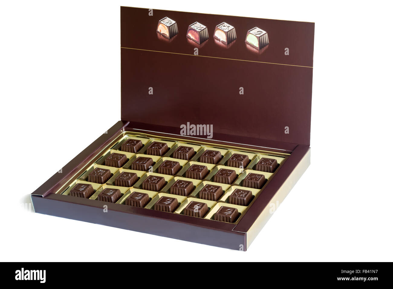 A variety of chocolate candies in a box. Presented on a white ...