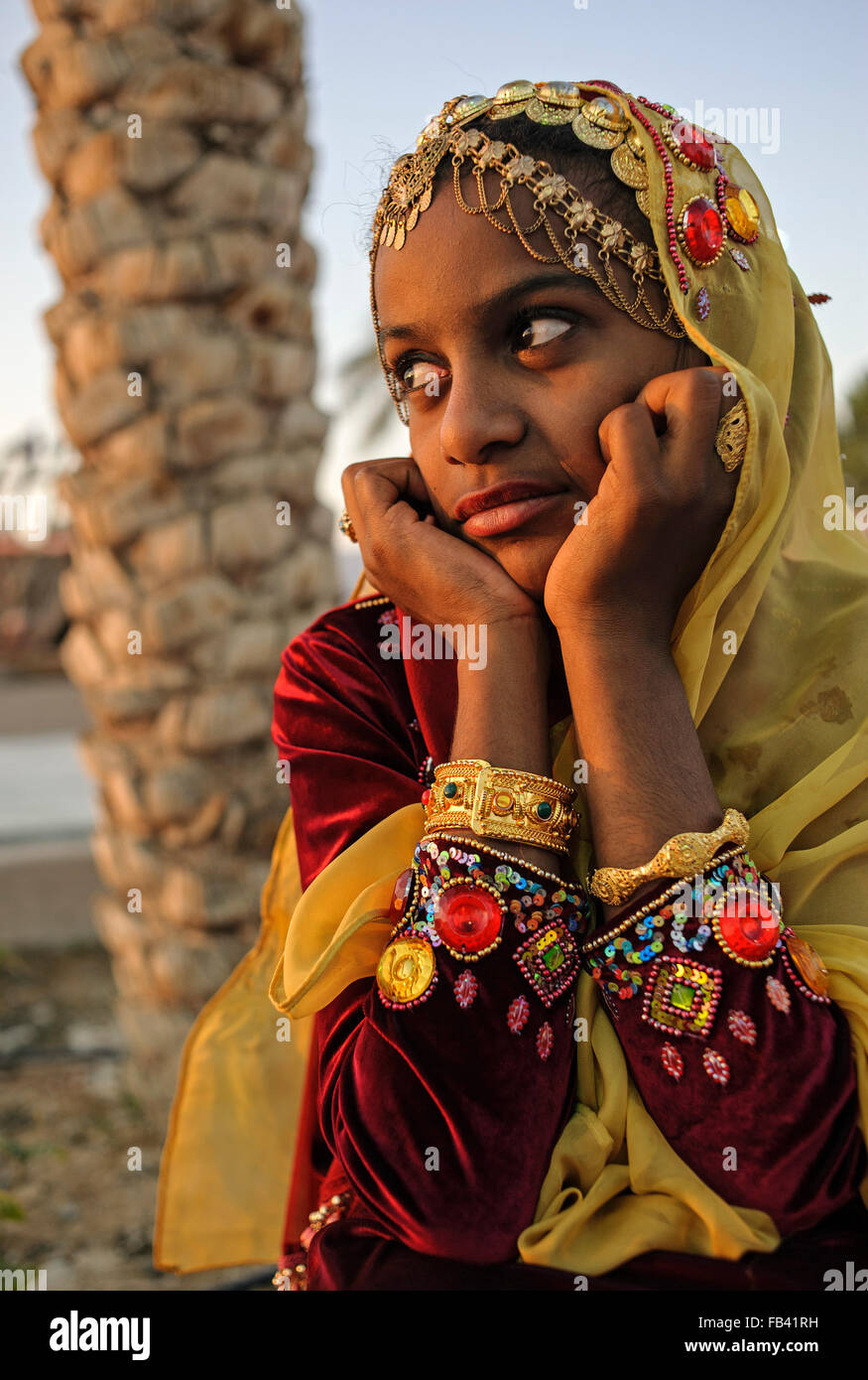 Young girl in traditional costume, Oman Stock Photo - Alamy