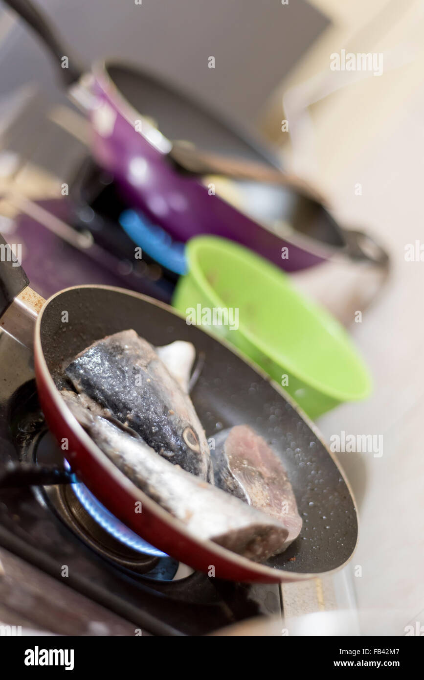 Tuna fish fried on the sauce pan in home kitchen Stock Photo - Alamy