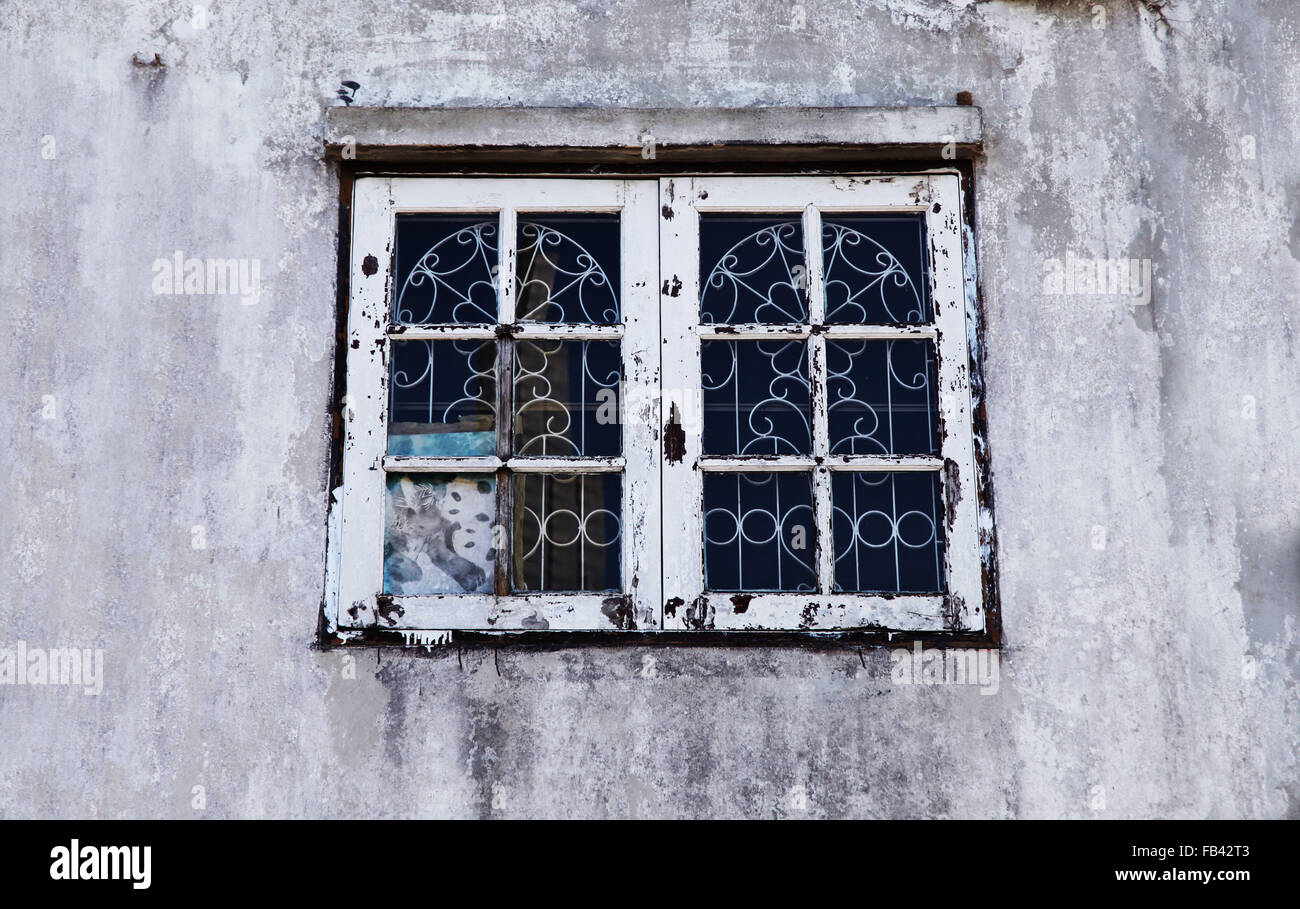 It's a photo of a window of a house in Thailand. It is view from ...