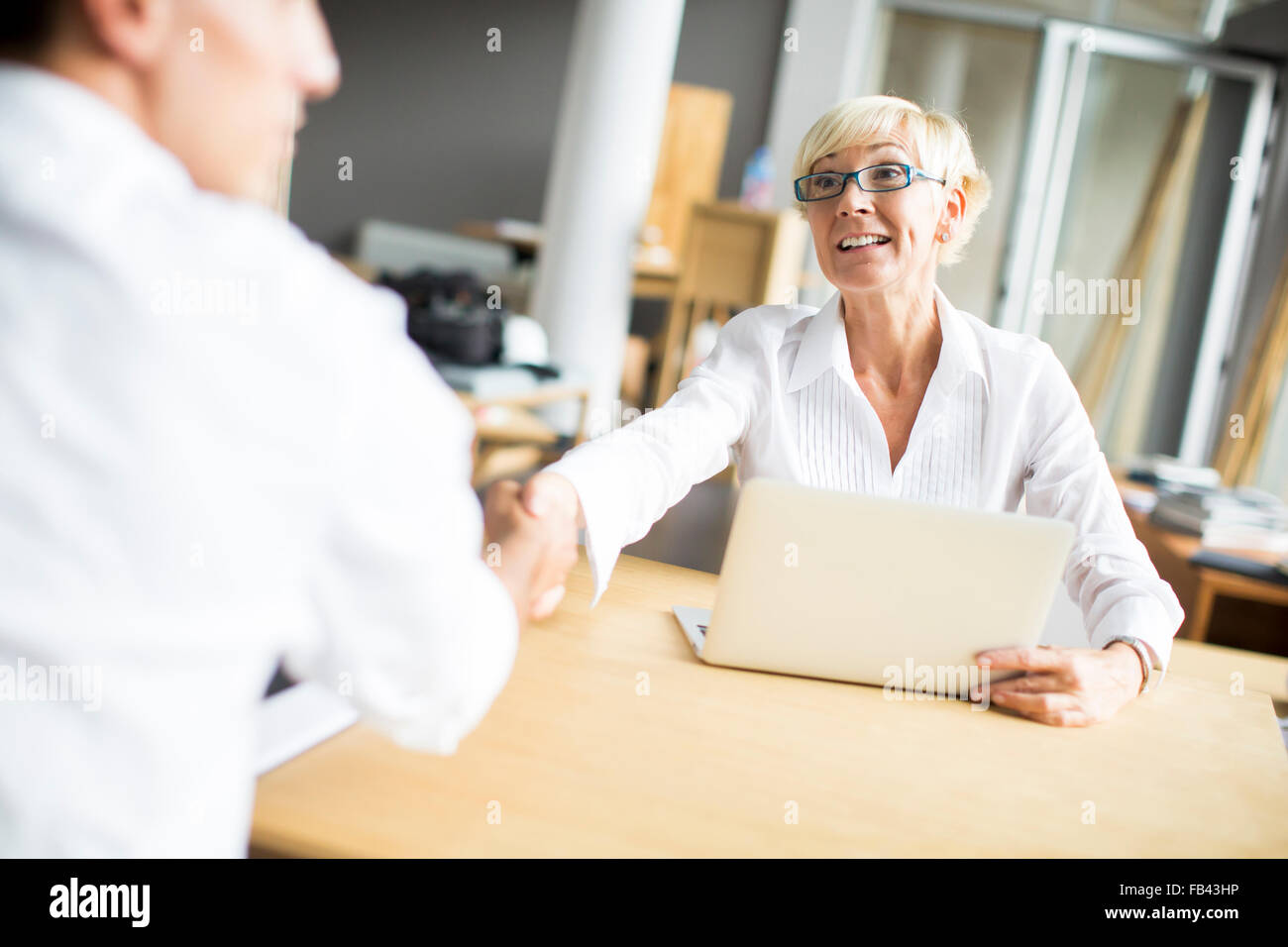 Business partners meeting shaking hands hi-res stock photography and ...