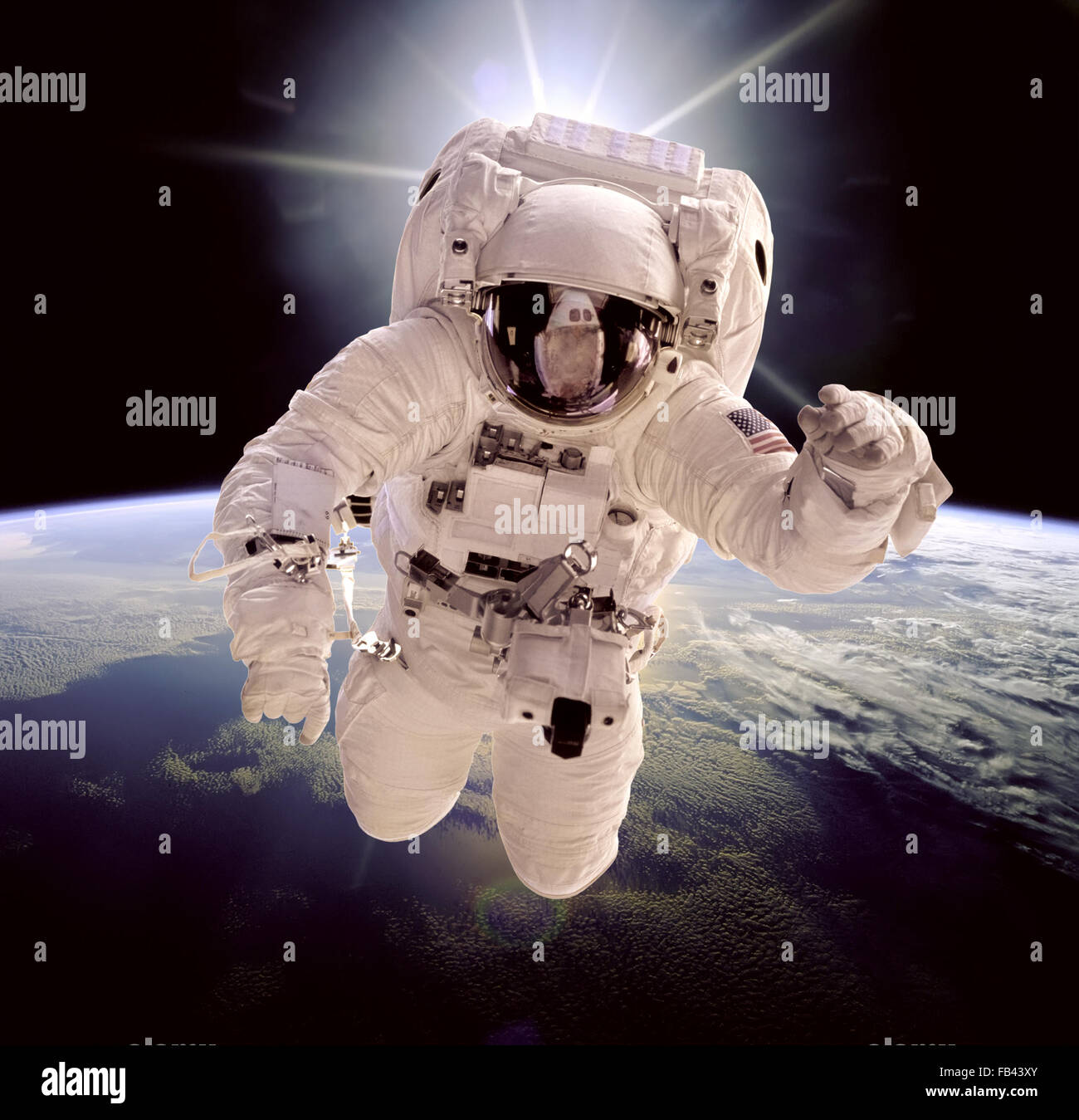 Astronaut in outer space against the backdrop of the planet earth ...