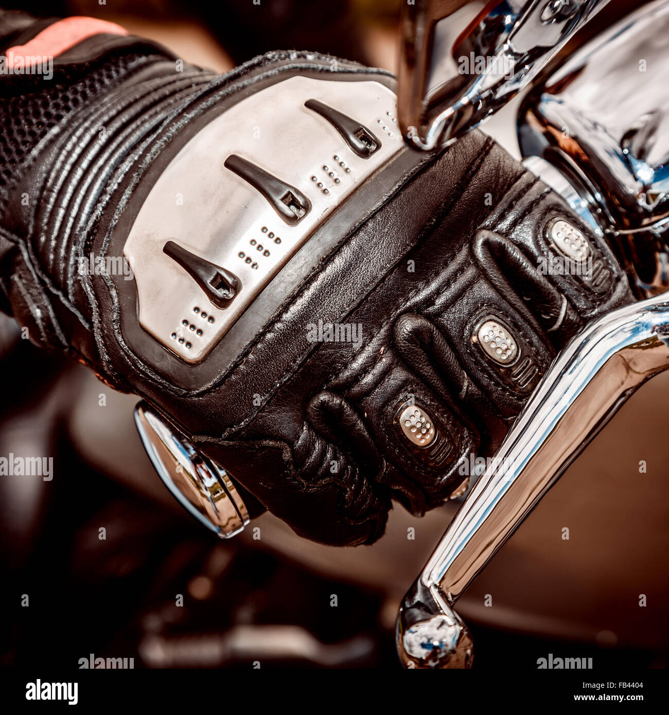 Human hand in a Motorcycle Racing Gloves holds a motorcycle throttle ...