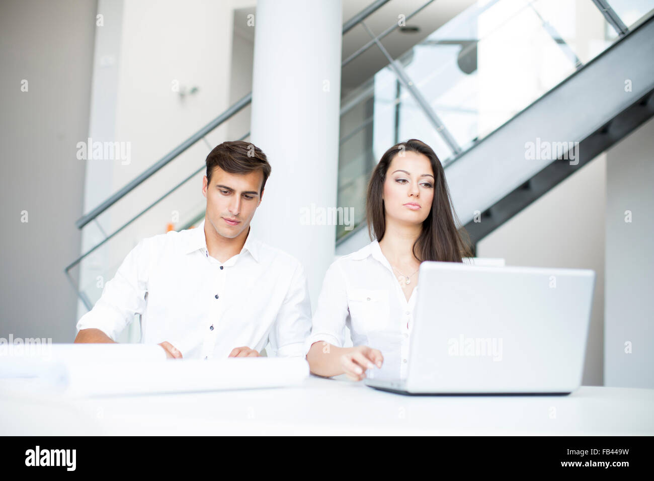 Young people in the office Stock Photo - Alamy