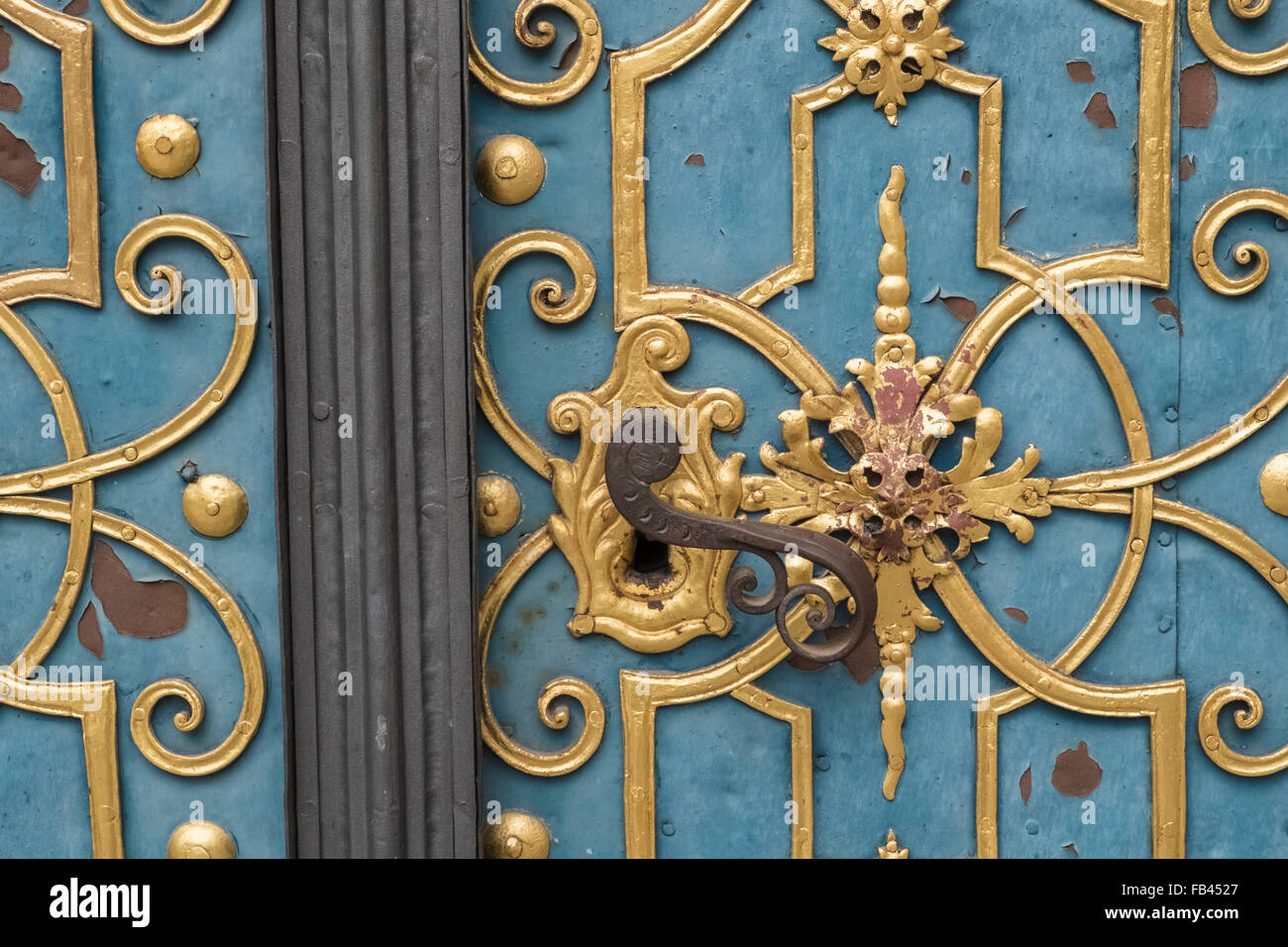 Elaborate ornate gilded door handle and entrance to Wroclaw University ...