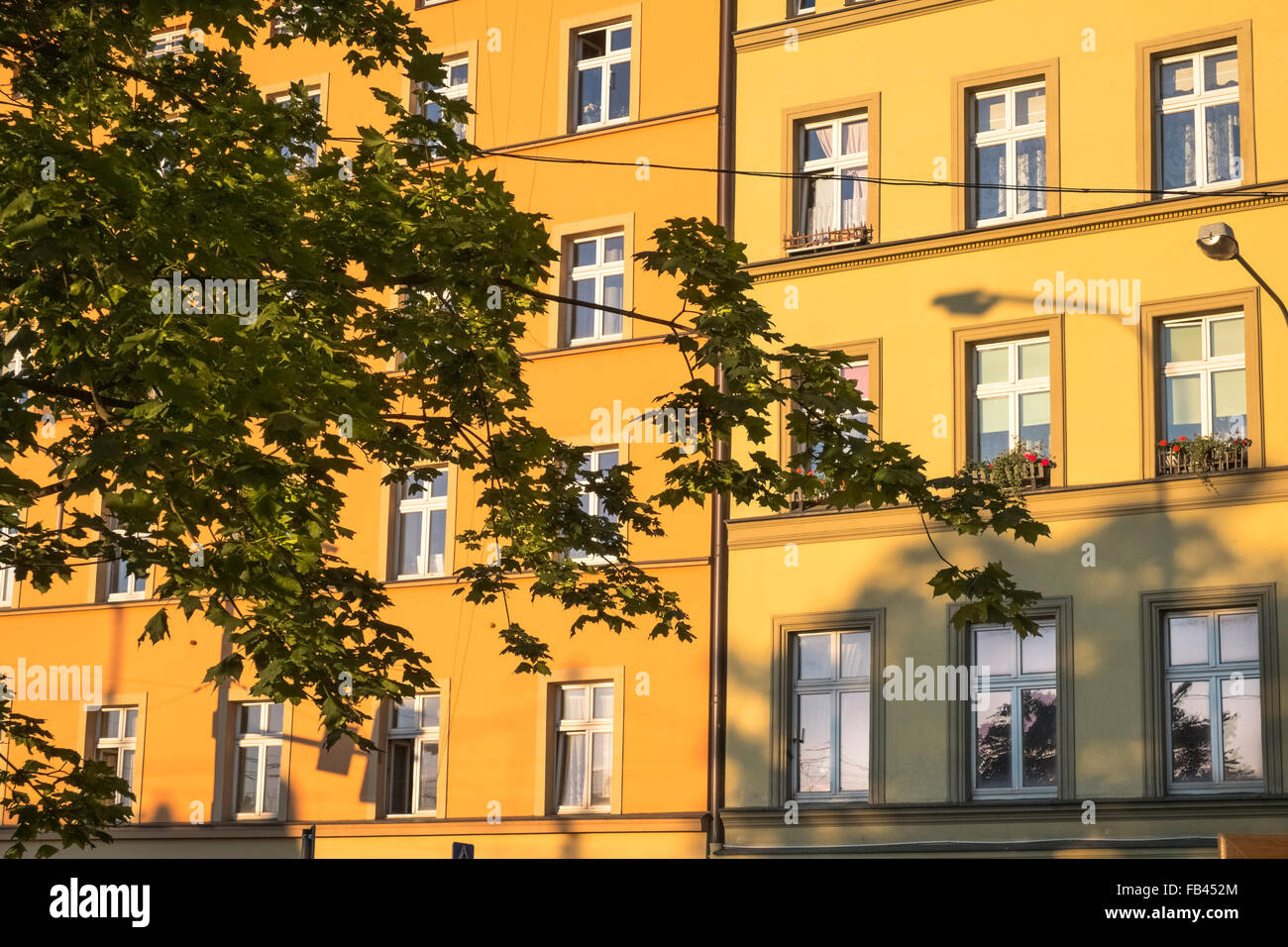 Bright coloured apartment buildings in early evening light, Krakow ...